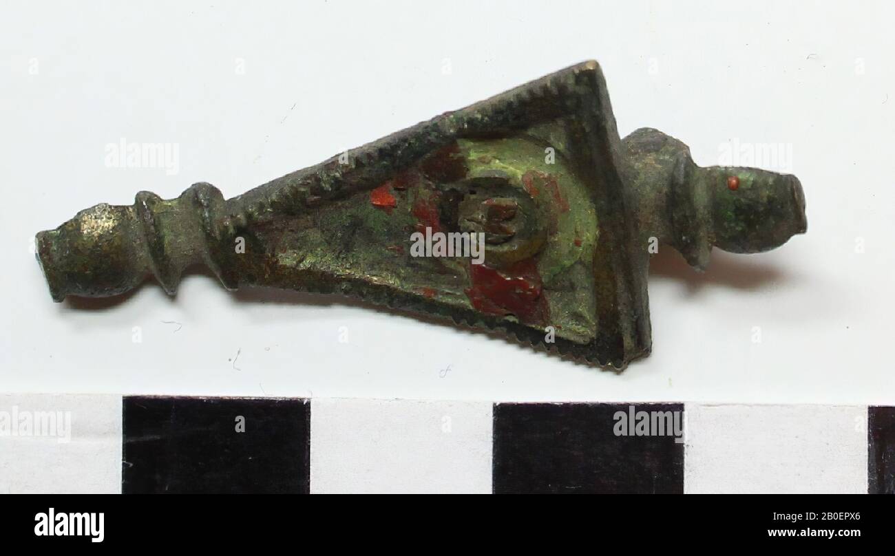 Fibula of bronze. Triangular disc with red and green enamel. Pin is ...