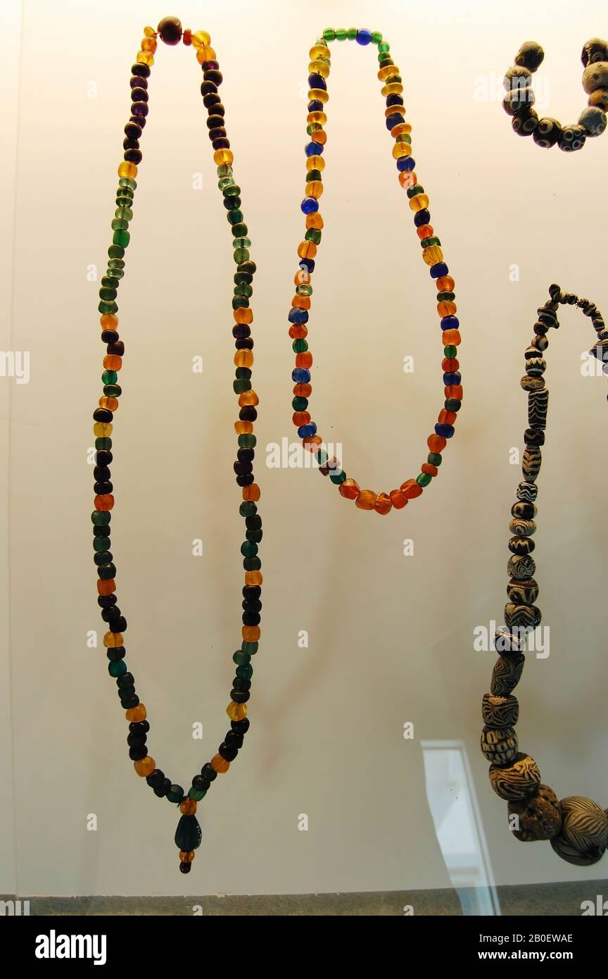 string of beads, string of beads of transparent blue, green, brown ...