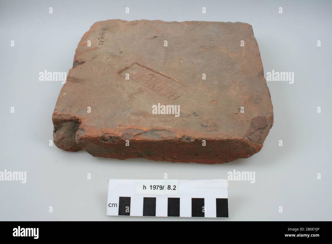 Oval bronze batter plate with two rivets, decorated with some simple ...