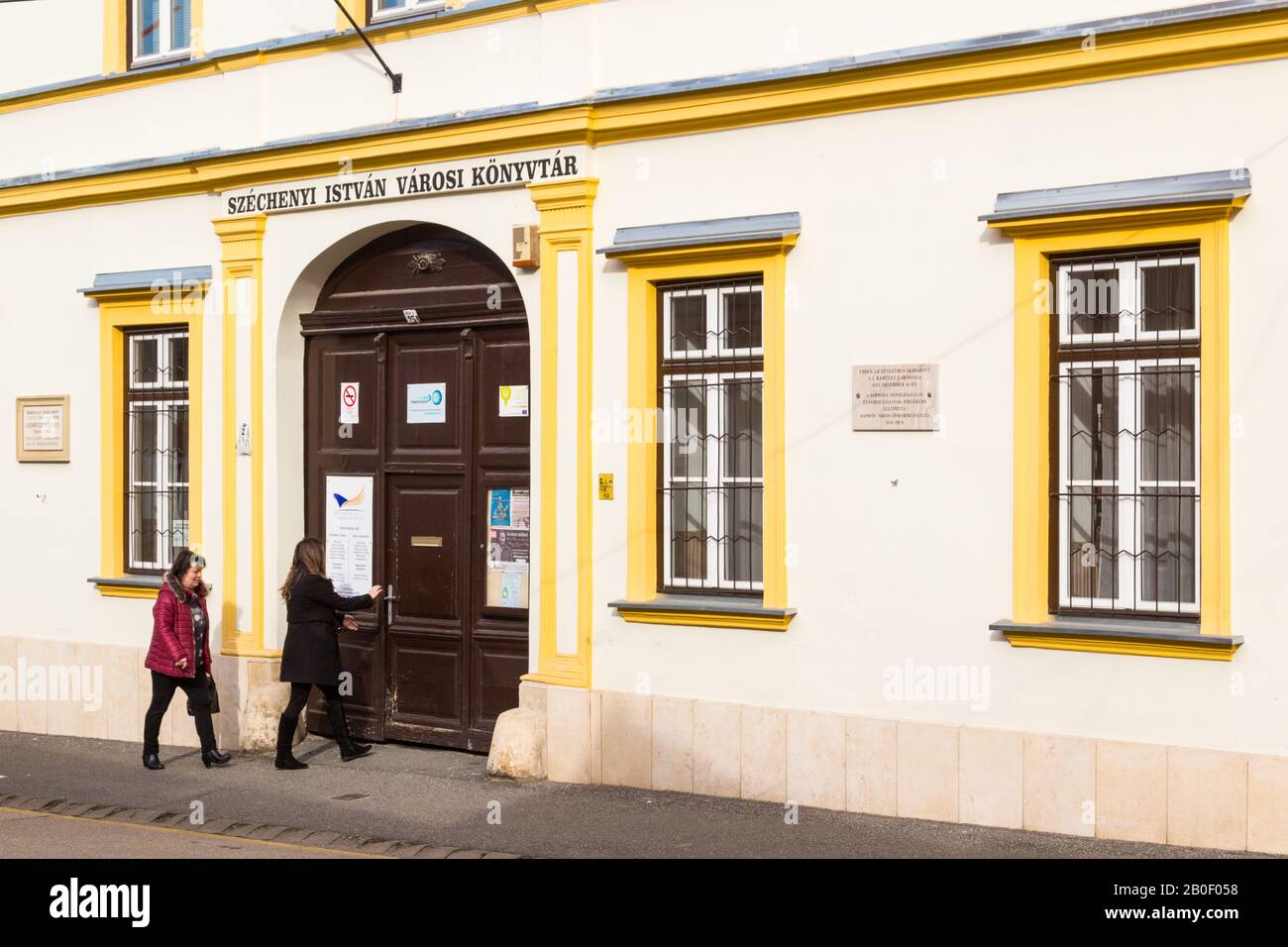 Women entering hi-res stock photography and images - Alamy