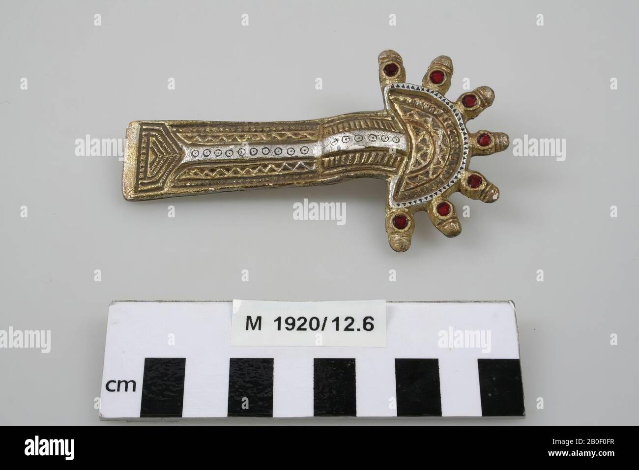 Casting of a decorated fibula, gold, red and silver painted., Casting ...