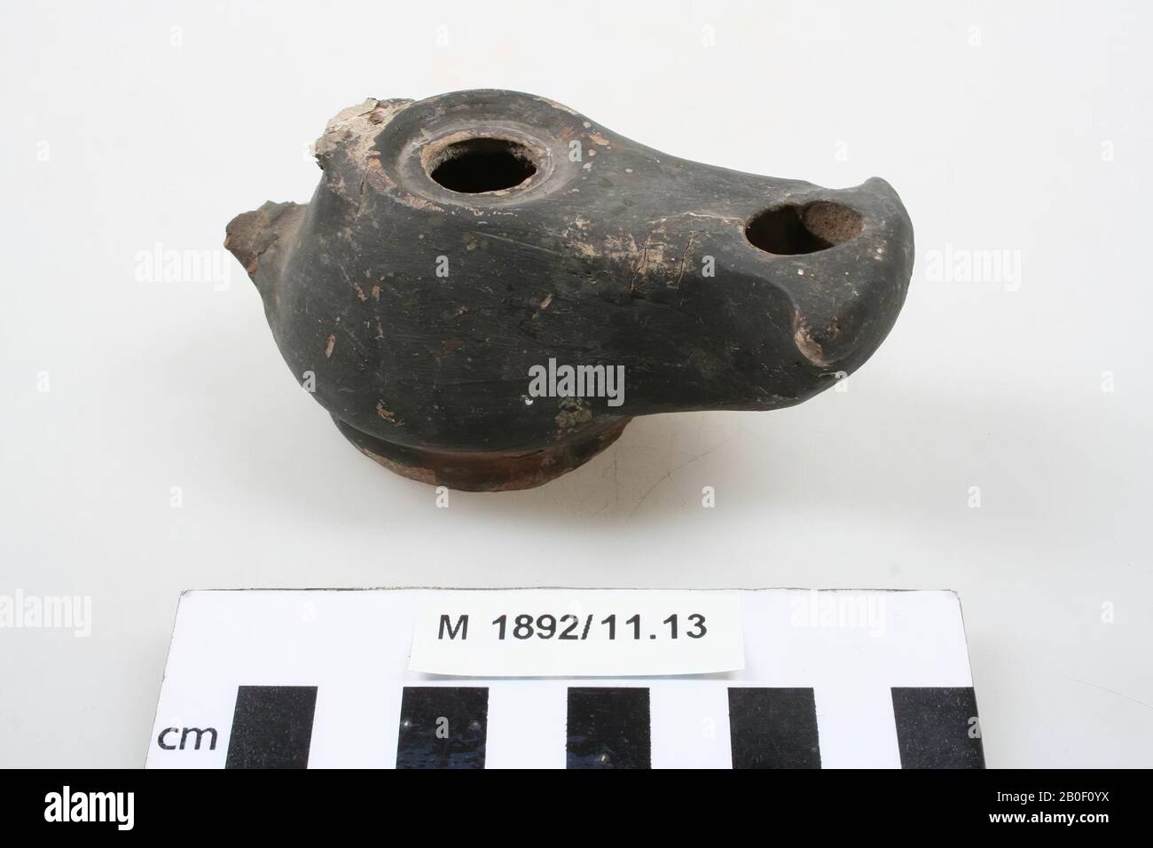 Oil lamp made of earthenware, with spout, filling hole and fire hole ...