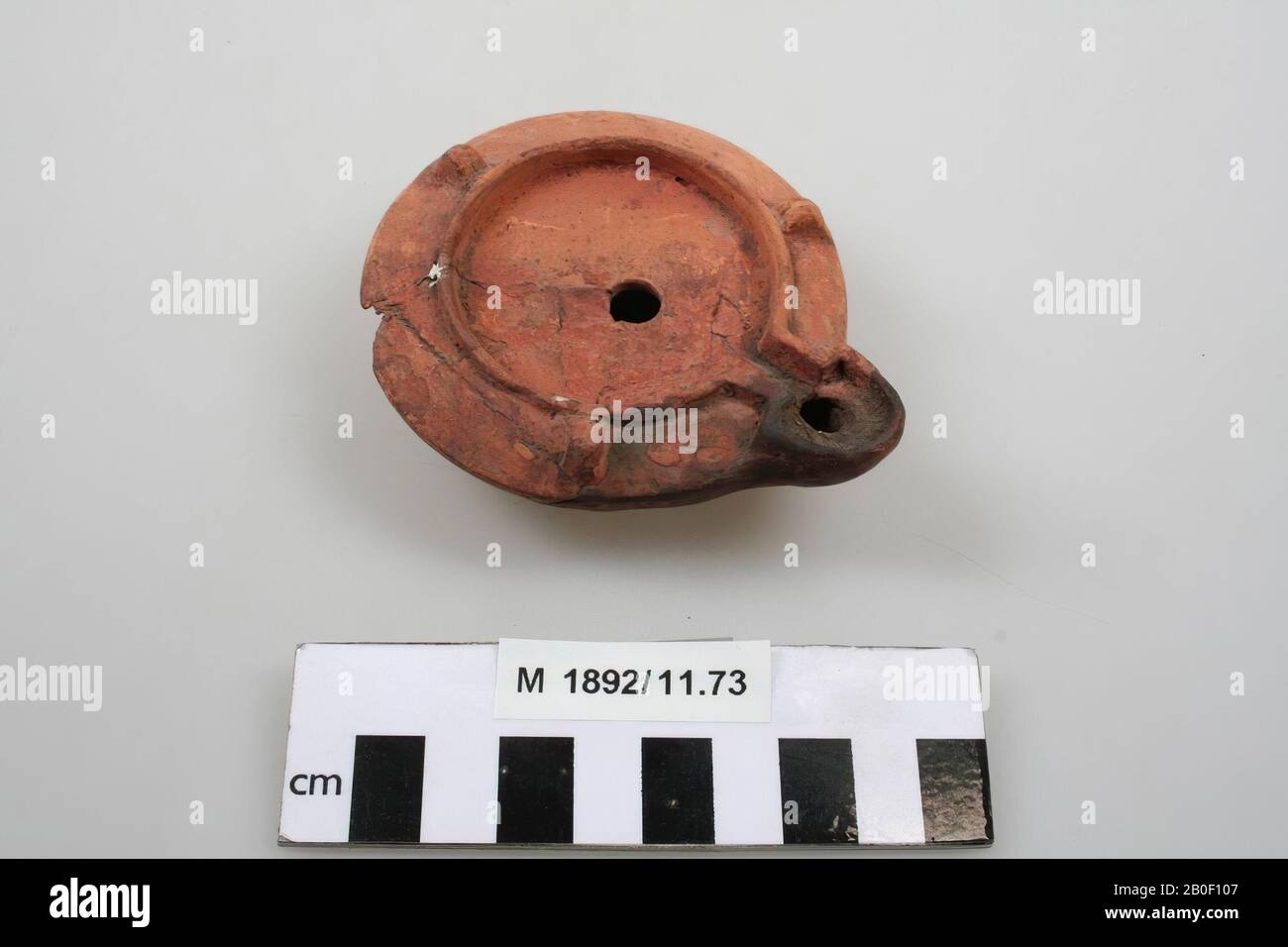 Oil lamp made of earthenware, without ear, with spout, filling hole and ...