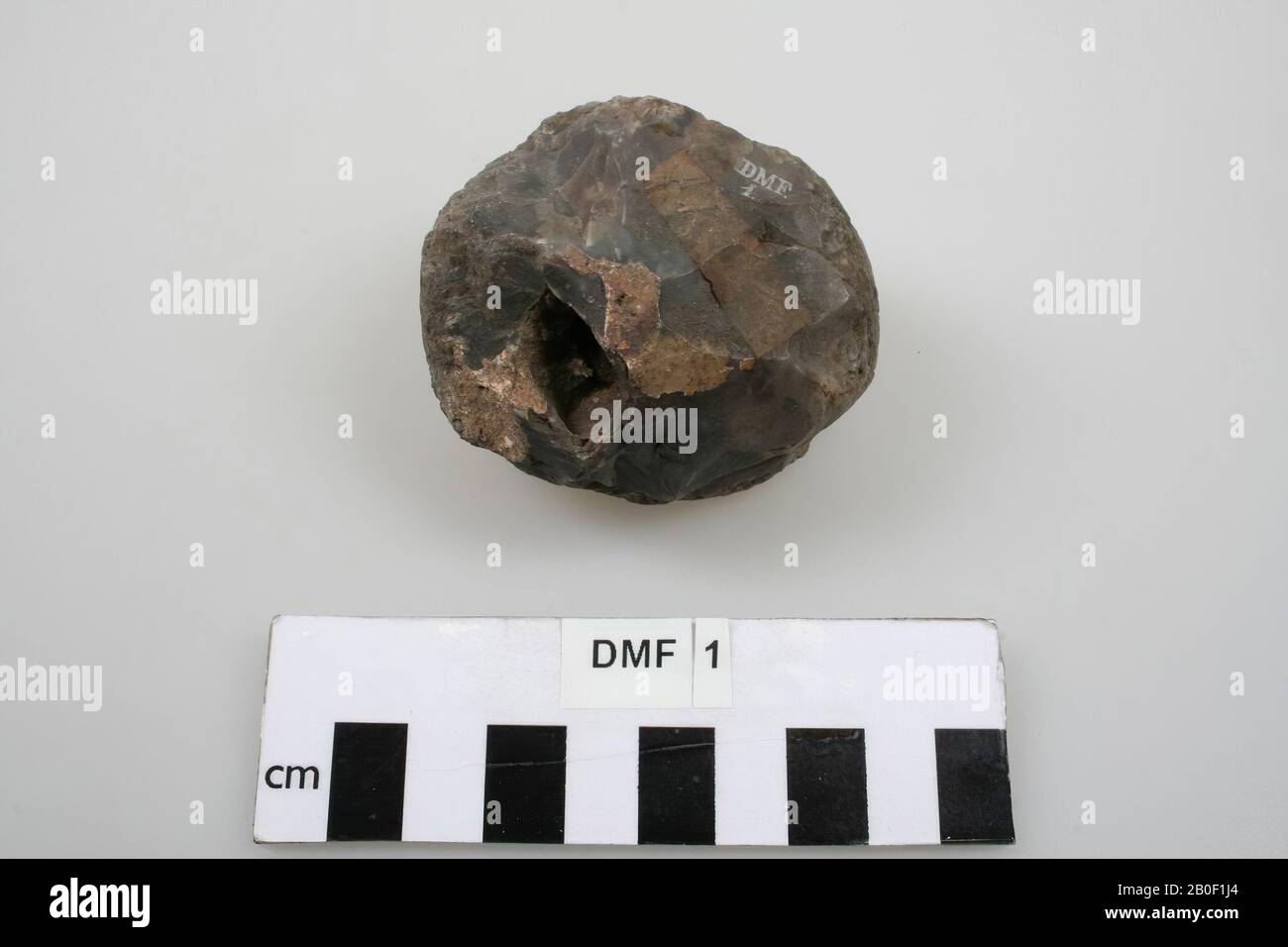 Tool, flint. With a (well-light drilled) hole in it., Tool, stone ...