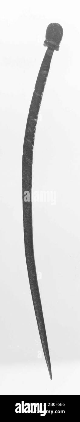 Bronze pen, rectangular in cross-section. At the top is a widened part ...