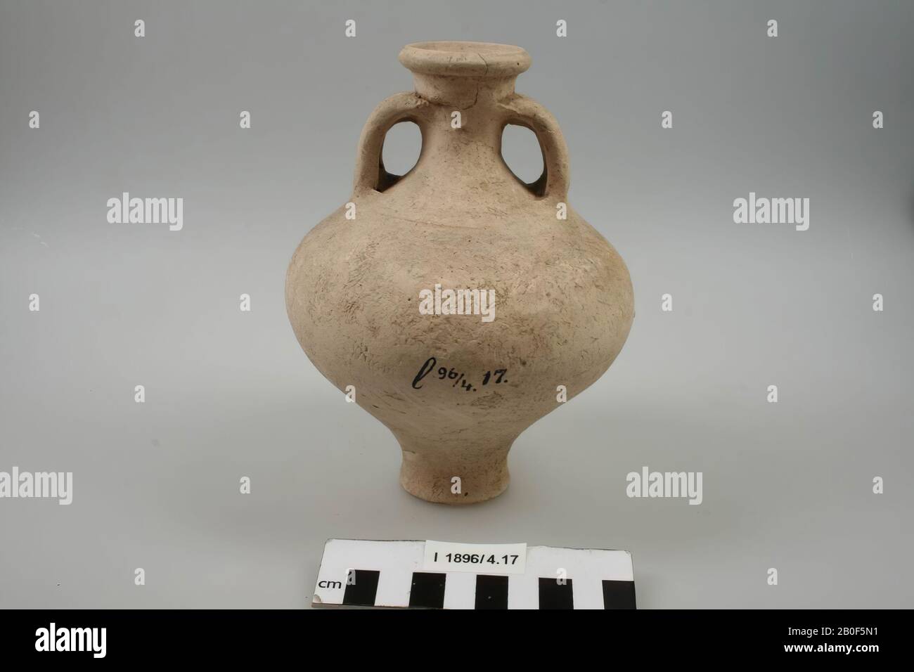 Jug with 2 ears of earthenware. Damage to the neck, old bonding to the ...