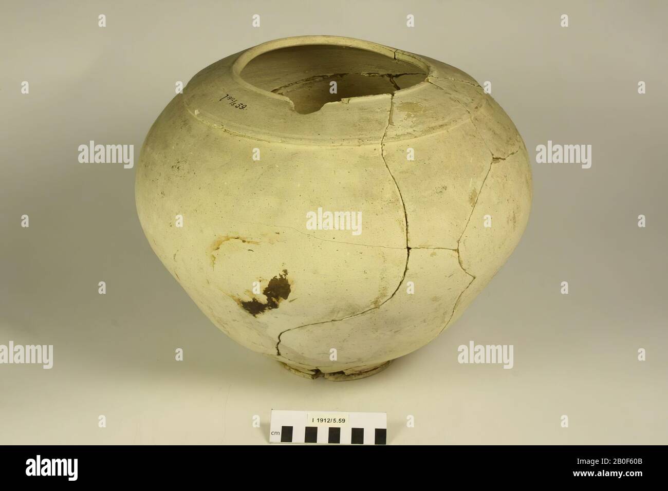 Dolium of white earthenware with a wide curved edge. Part of the edge ...