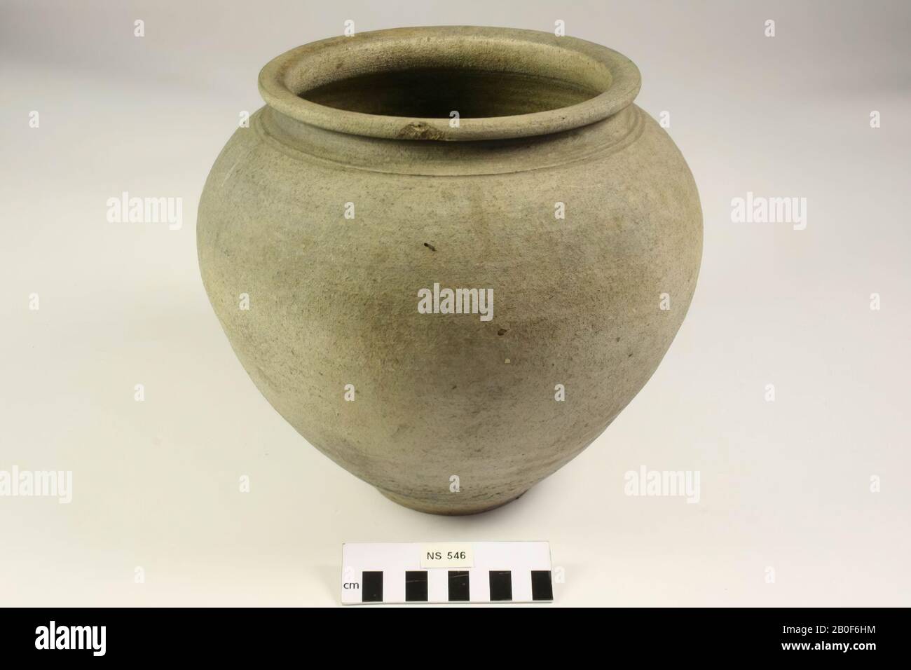 Roman oval urn of rough-walled light gray earthenware with outwardly ...