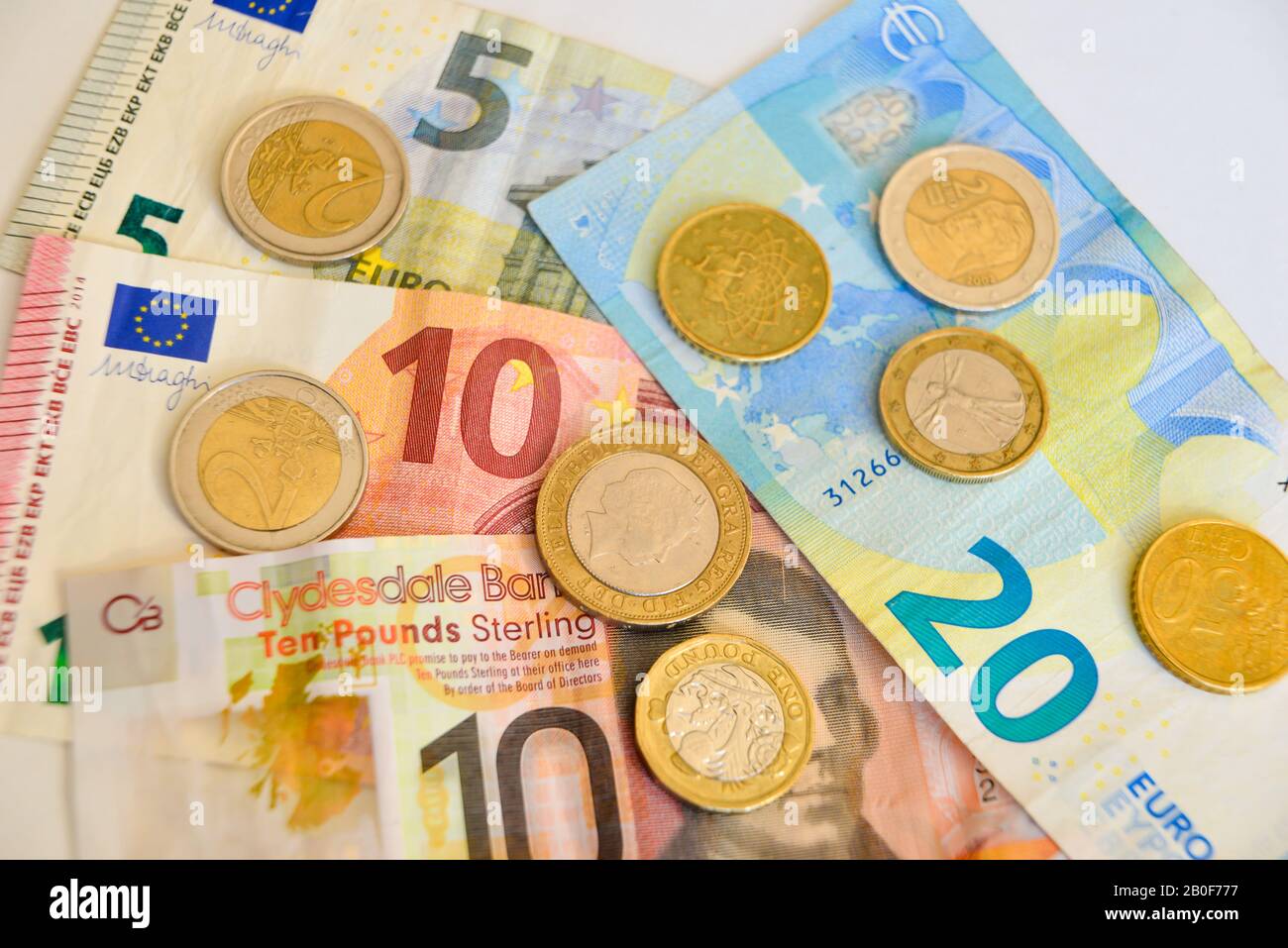Euro and Pound coins and banknotes Stock Photo - Alamy