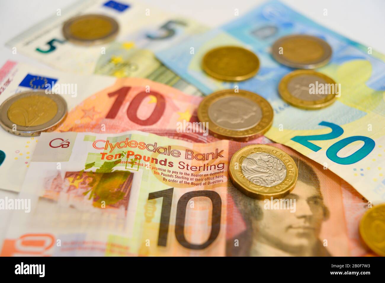 Euro and Pound coins and banknotes Stock Photo - Alamy