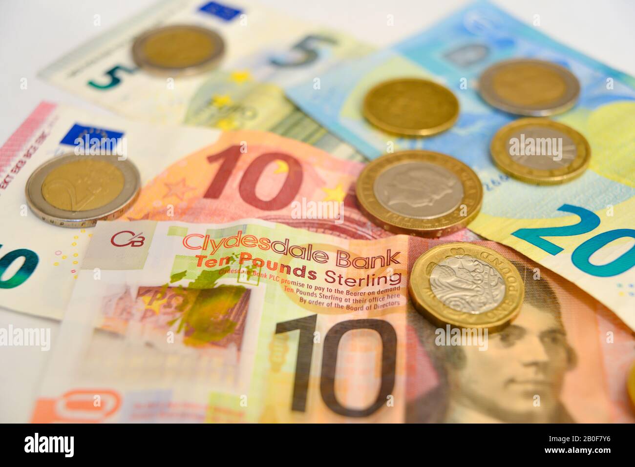Euro and Pound coins and banknotes Stock Photo - Alamy