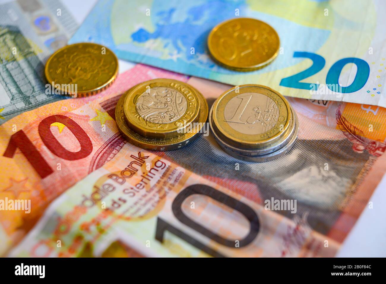 Euro and Pound coins and banknotes Stock Photo - Alamy
