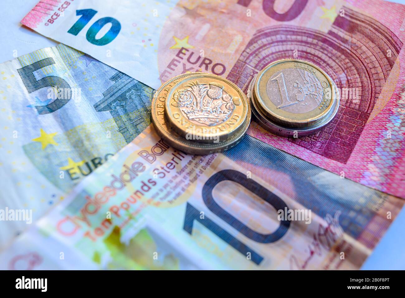 Euro and Pound coins and banknotes Stock Photo - Alamy