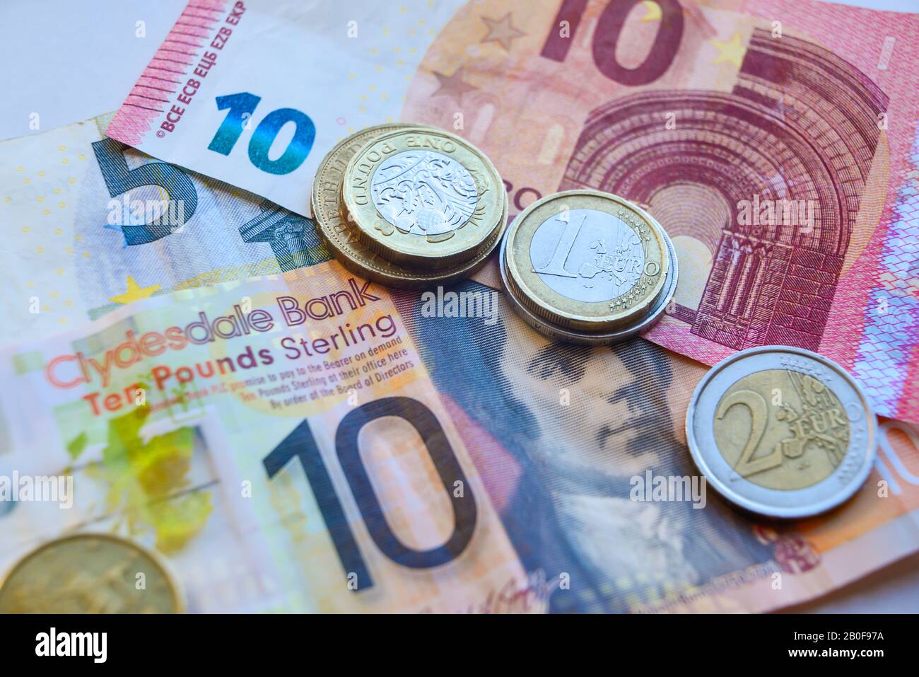 Euro and Pound coins and banknotes Stock Photo - Alamy
