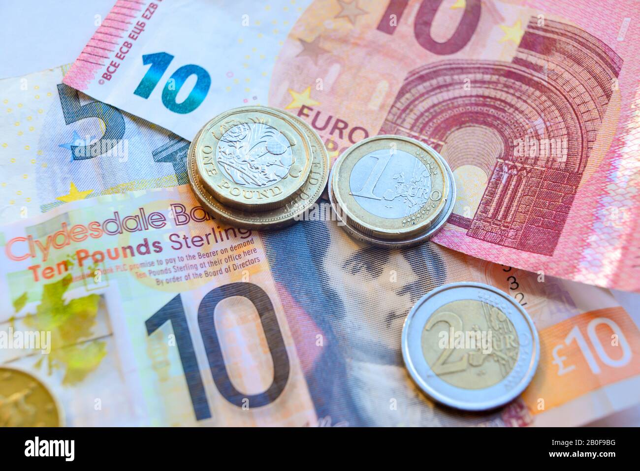 Euro and Pound coins and banknotes Stock Photo - Alamy