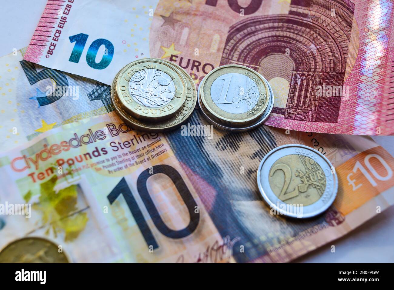 Euro and Pound coins and banknotes Stock Photo - Alamy