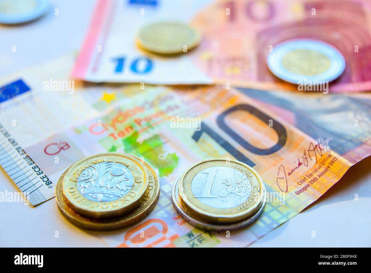 Euro and Pound coins and banknotes Stock Photo - Alamy