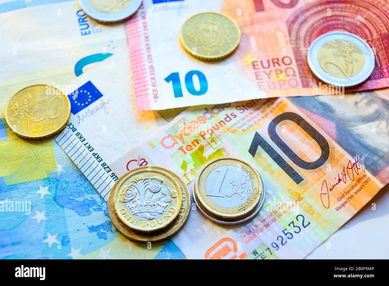 Euro and Pound coins and banknotes Stock Photo - Alamy