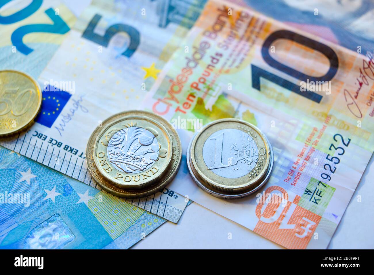 Euro and Pound coins and banknotes Stock Photo - Alamy