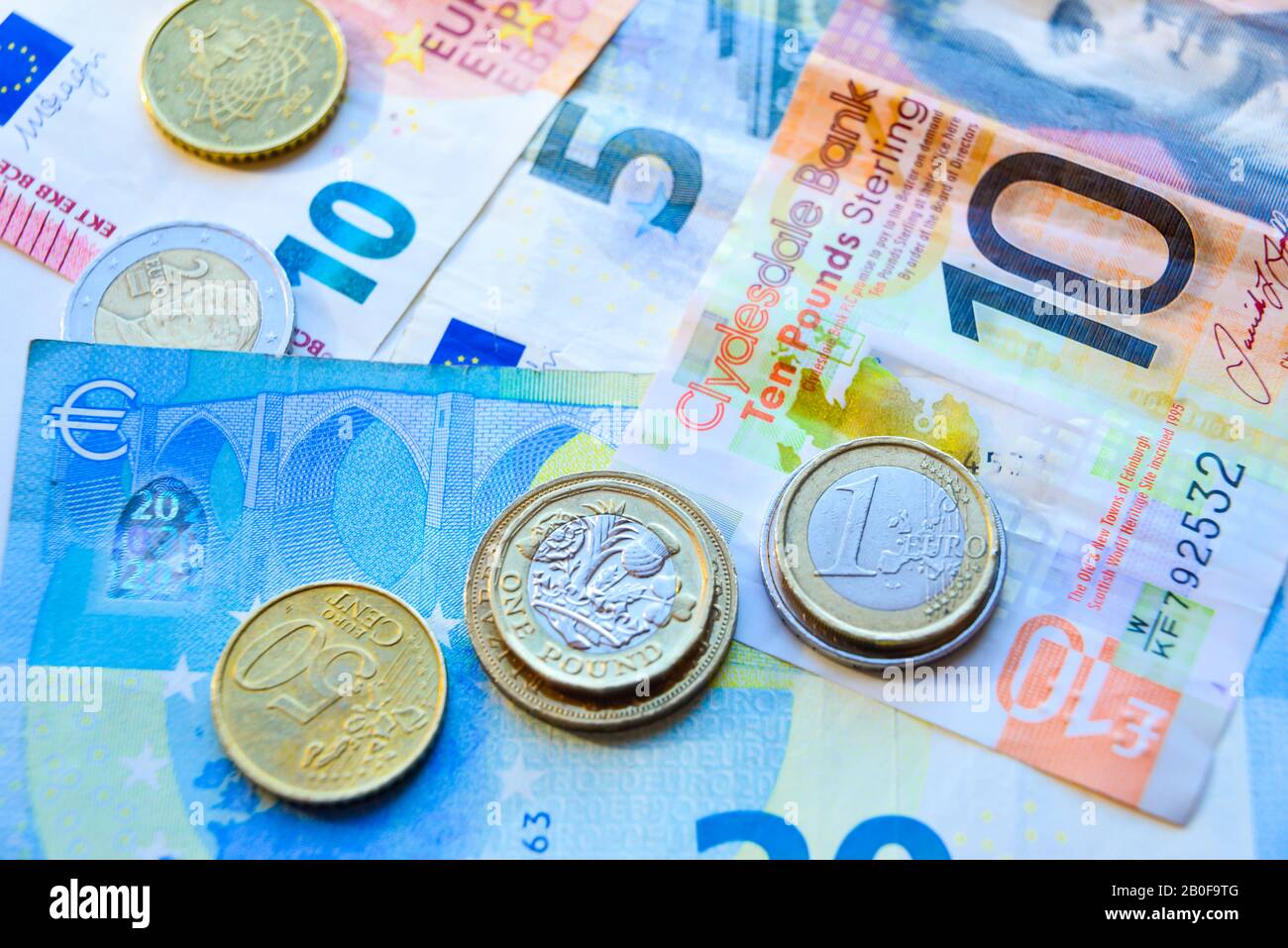 Euro and Pound coins and banknotes Stock Photo - Alamy