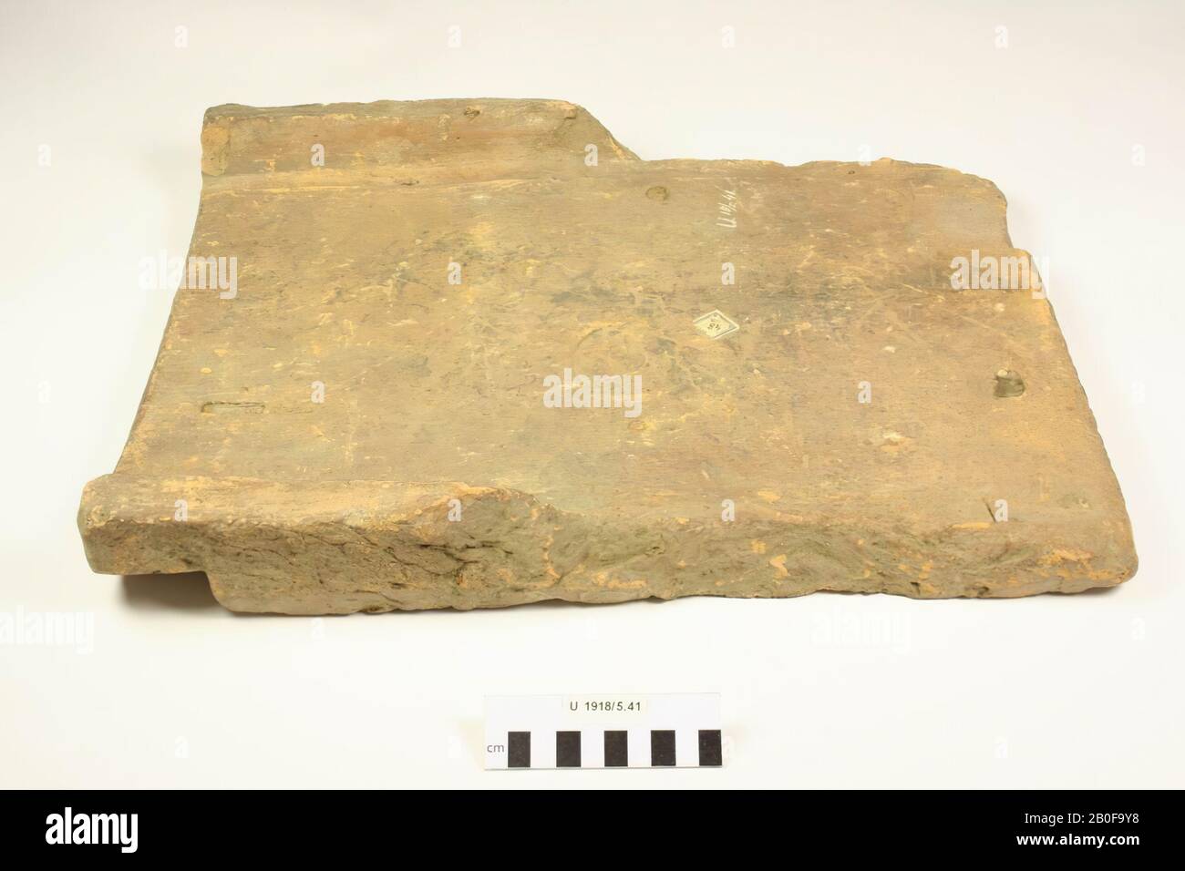 Tegula (roof tile) of brick with round stamp (VEX) EXGER. Parts of the ...