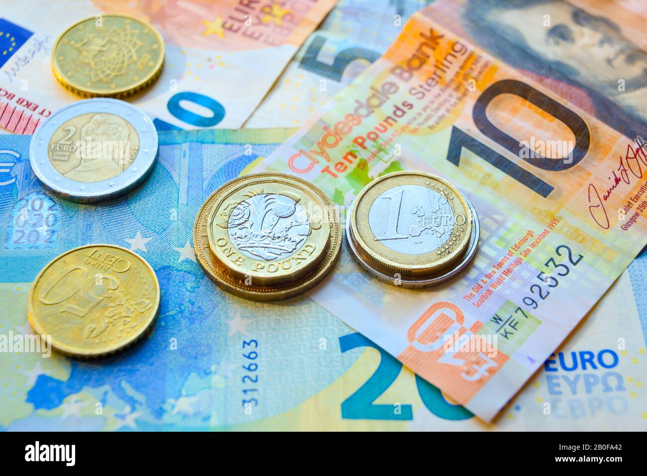 Euro and Pound coins and banknotes Stock Photo - Alamy