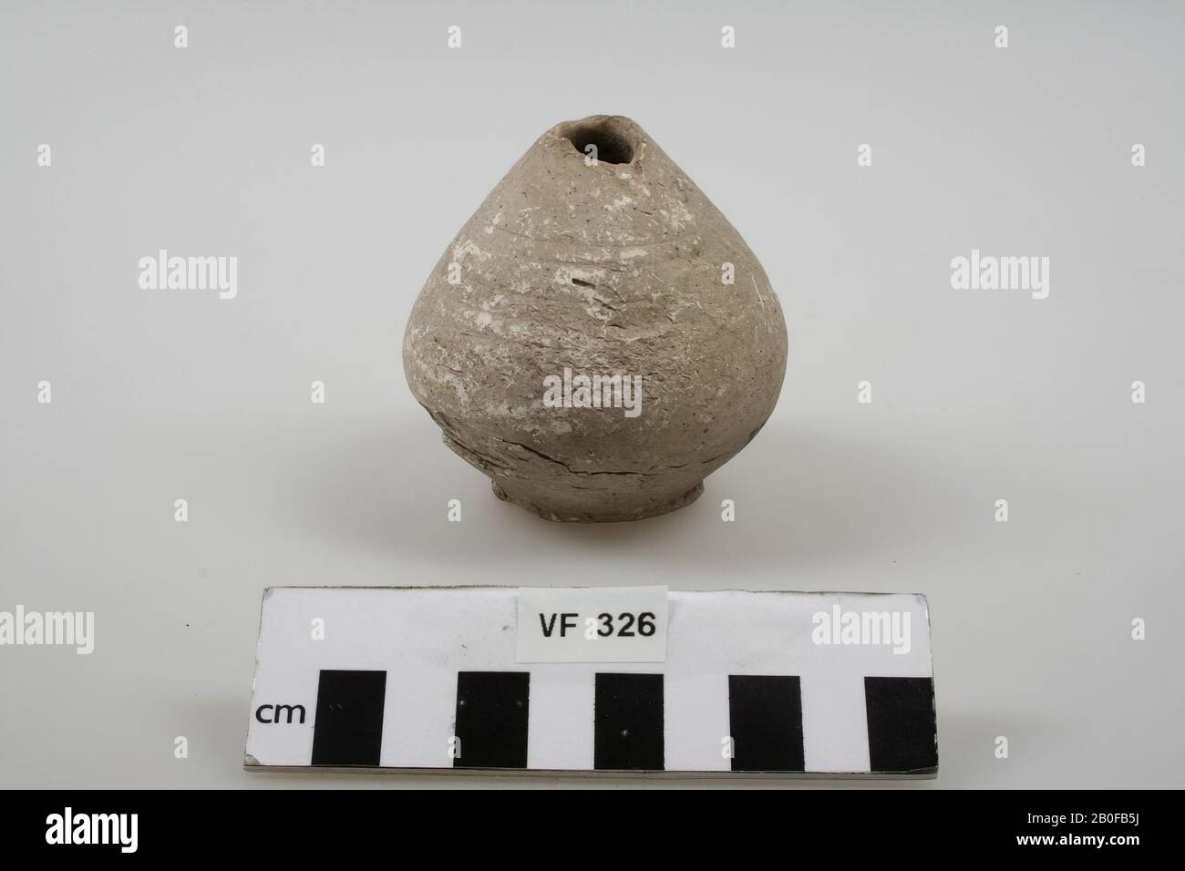 Bag-shaped pot with narrow neck and opening, the neck is missing. With ...