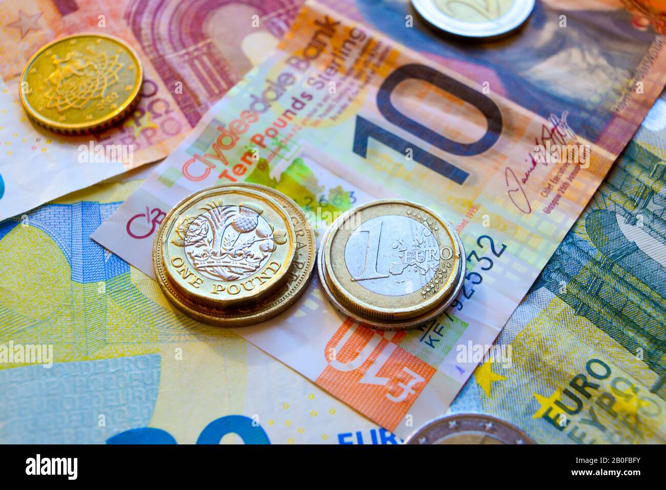 Euro and Pound coins and banknotes Stock Photo - Alamy