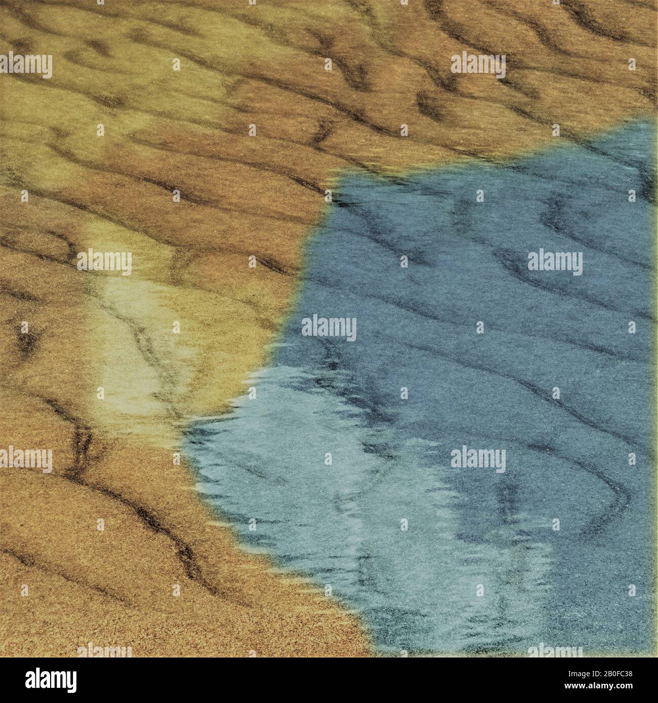 Abstract detailed tidal patterns in the sand at low tide on Penbryn ...