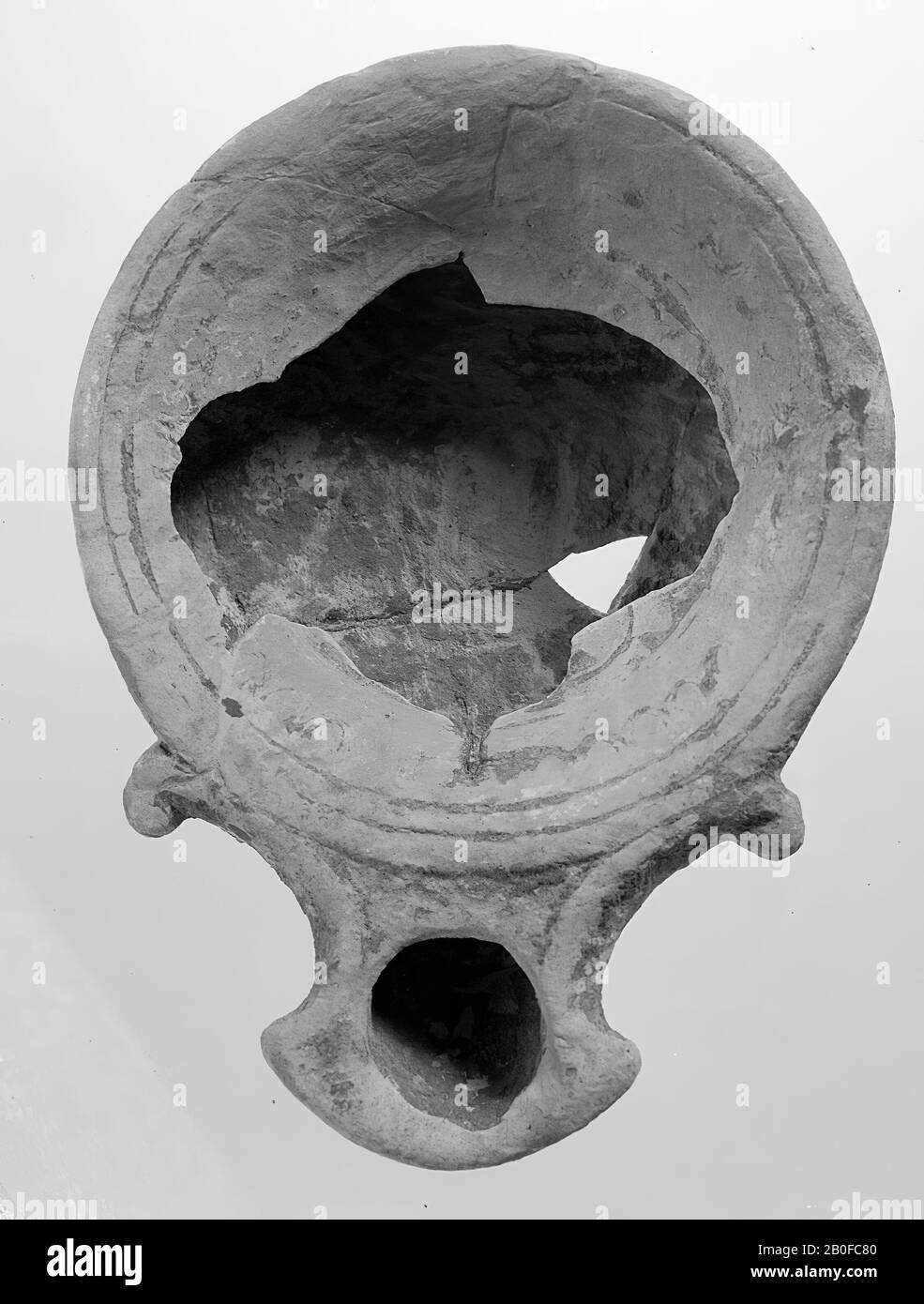 A gray-gray light with a round body. The round, concave mirror is ...