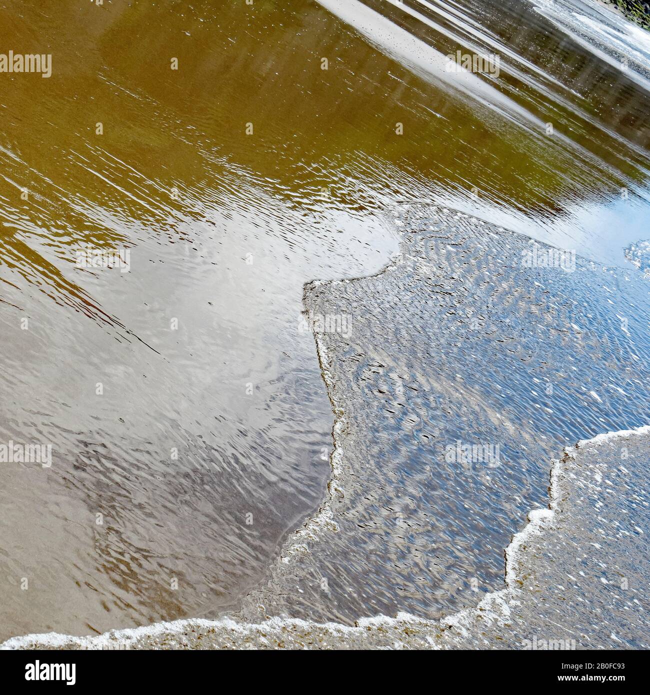 Abstract detailed tidal patterns in the sand at low tide on Penbryn ...