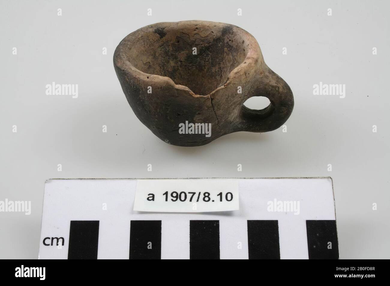 Cup with ear. Burst of the neck over the belly, part of the neck is ...