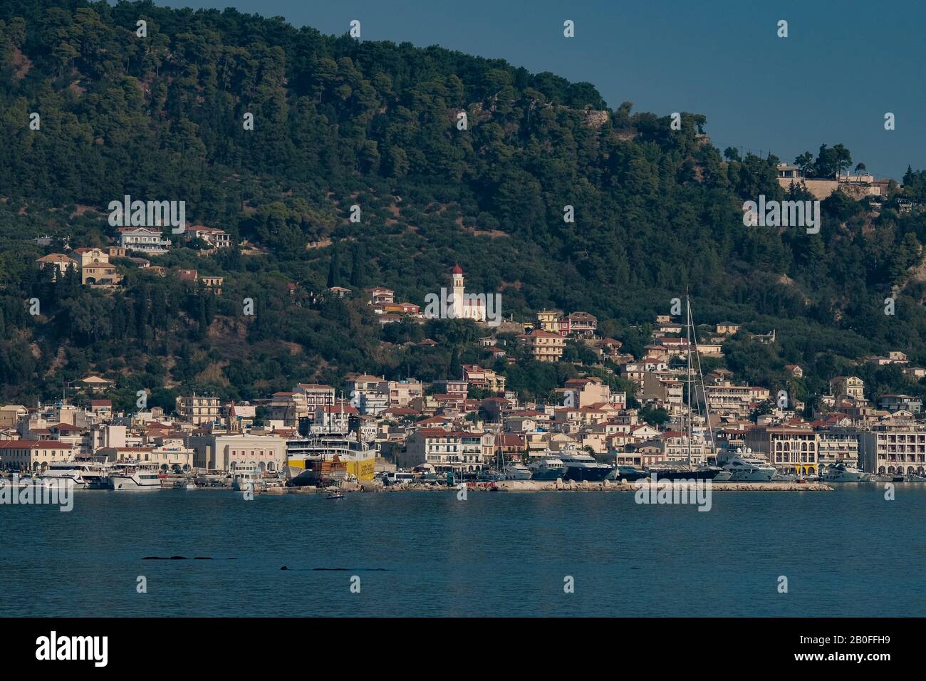 A long lens view of the port of Zakynthos town showing the buildings ...
