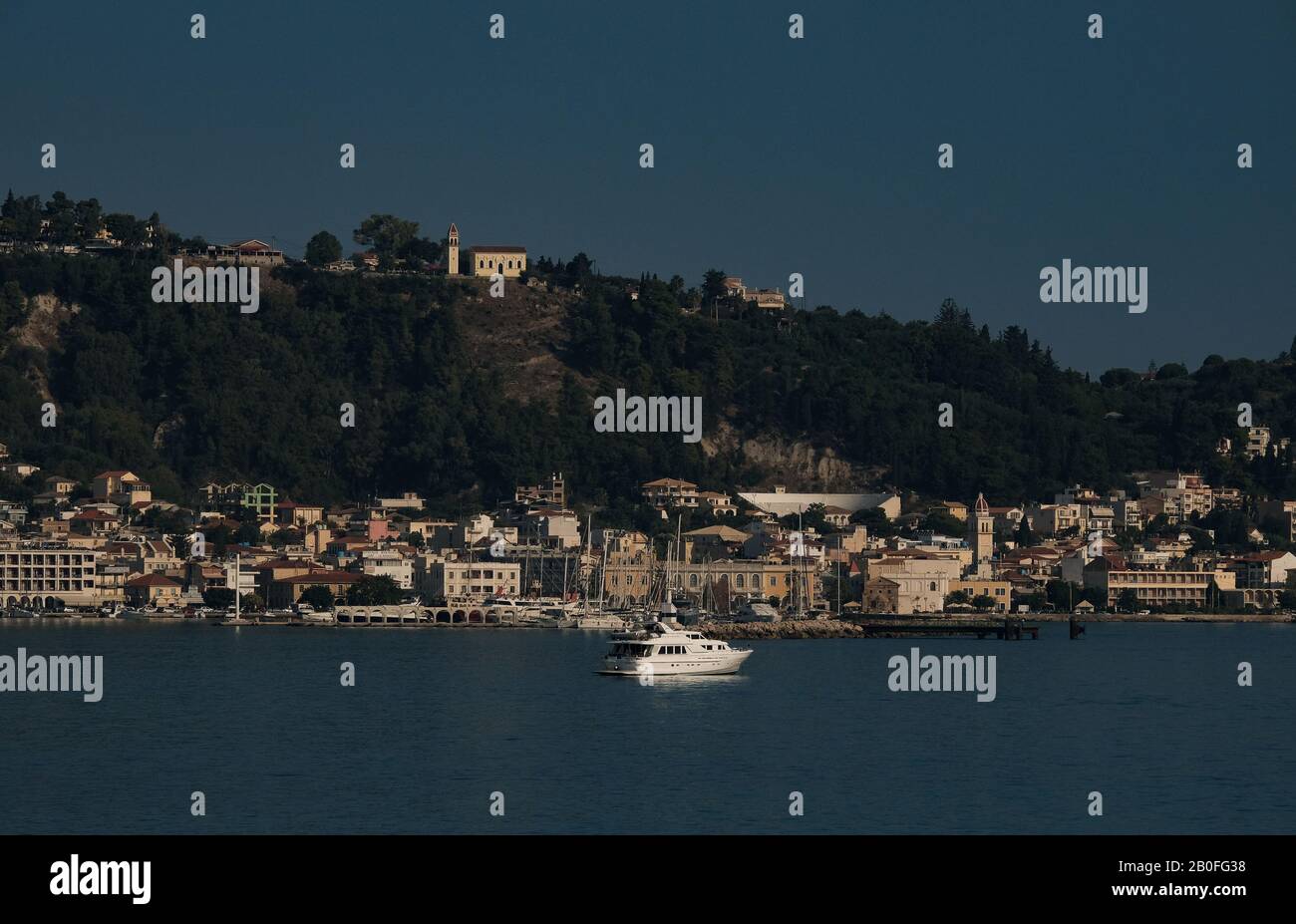 A long lens view of the port of Zakynthos town showing the buildings ...