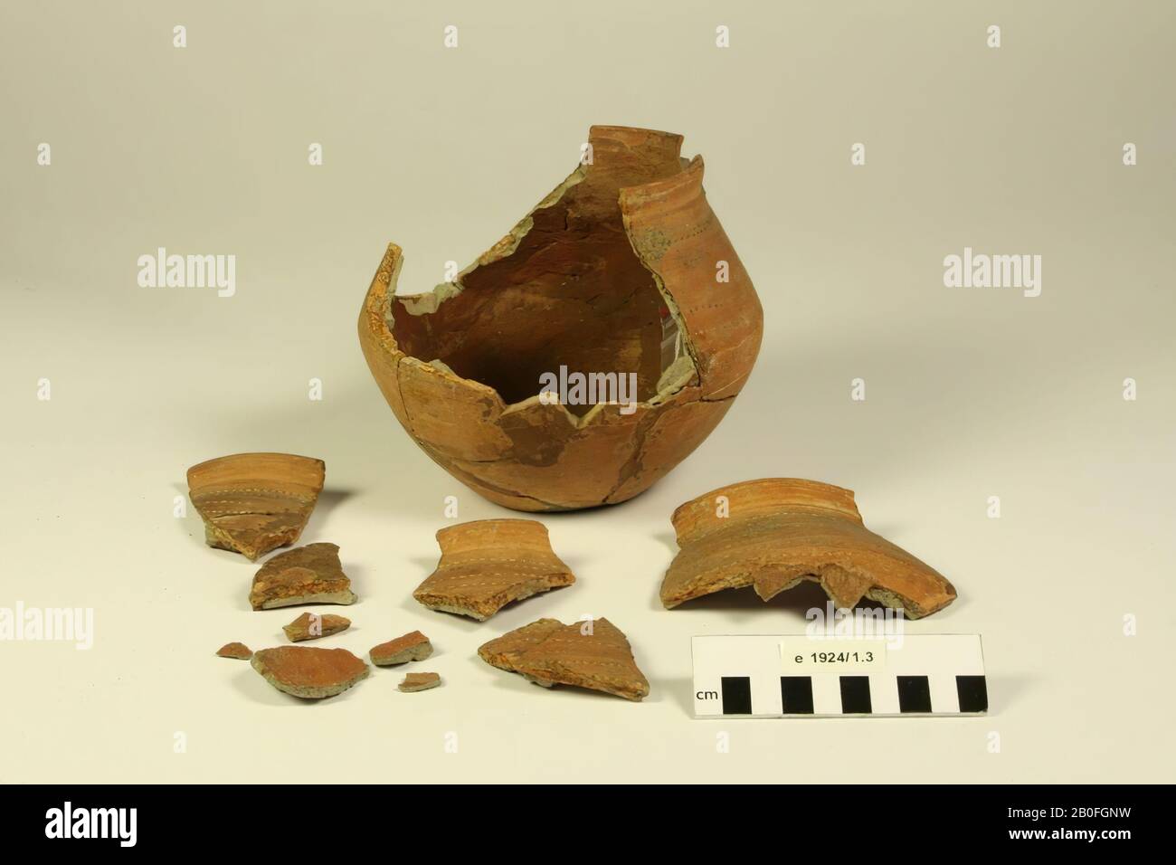 Red spherical pot with a board decoration. Pot consists of bonding ...