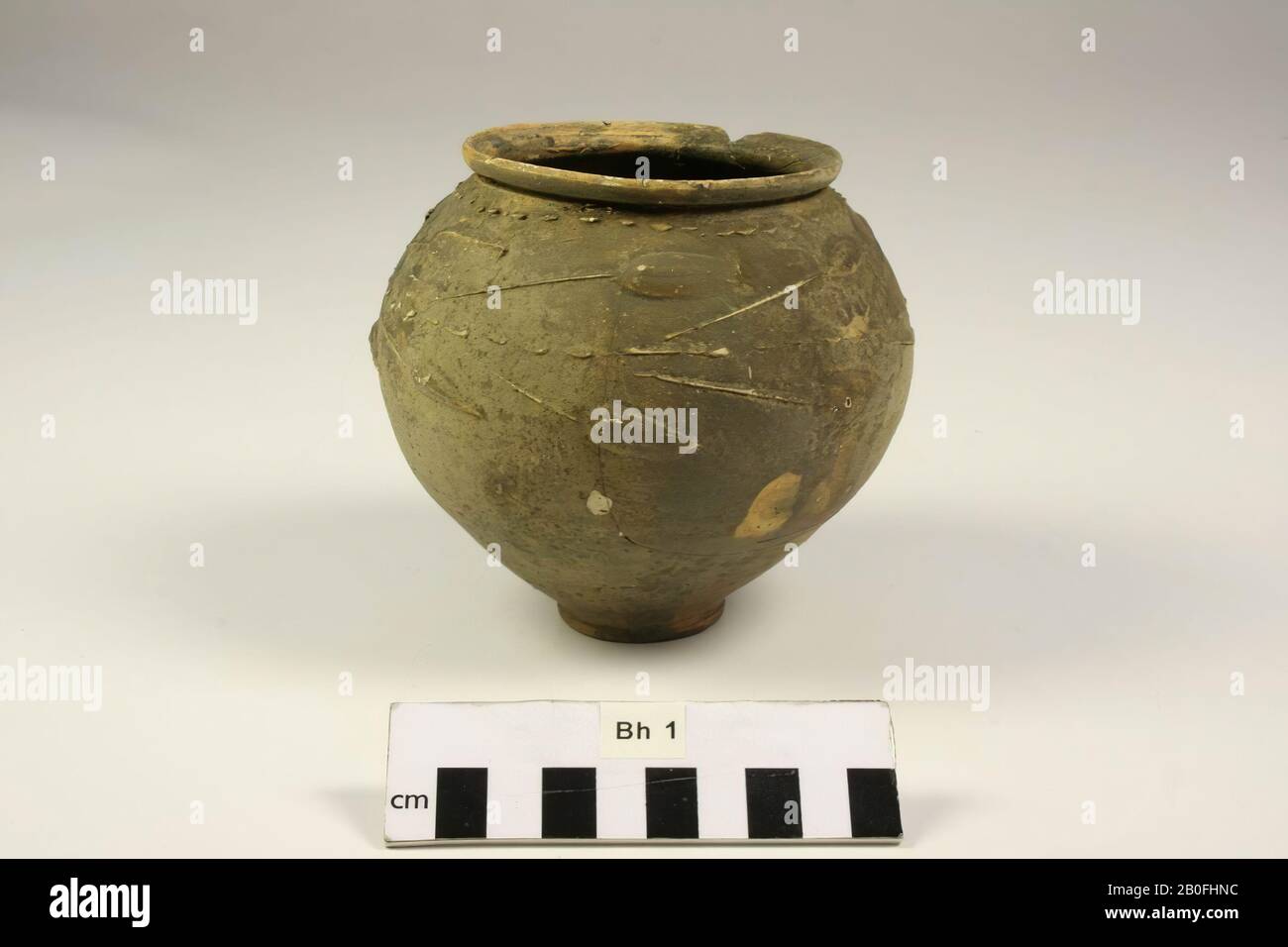 Pot of brown painted earthenware with barbotine decoration. Old bonding ...