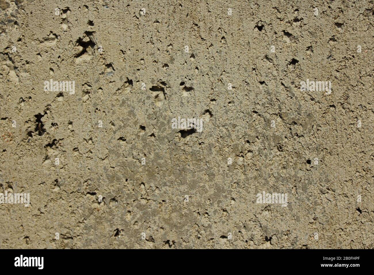 The picture shows a background with a greystone wall Stock Photo - Alamy