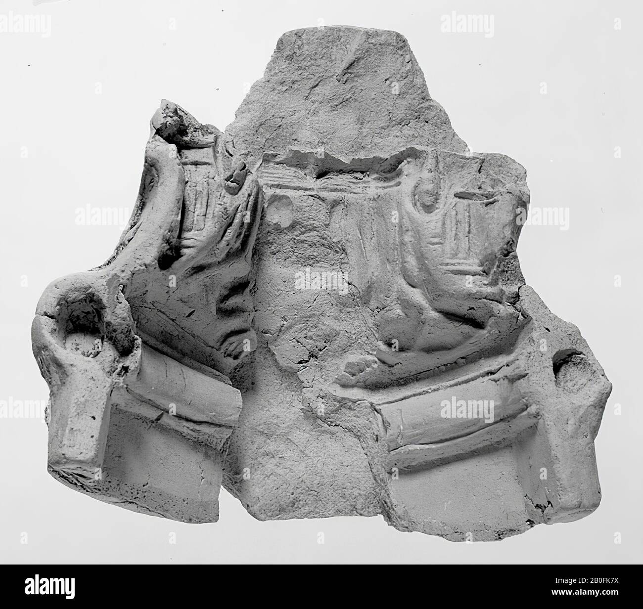 Single mold (front). Profiled pedestal with part of sitting figure, two ...