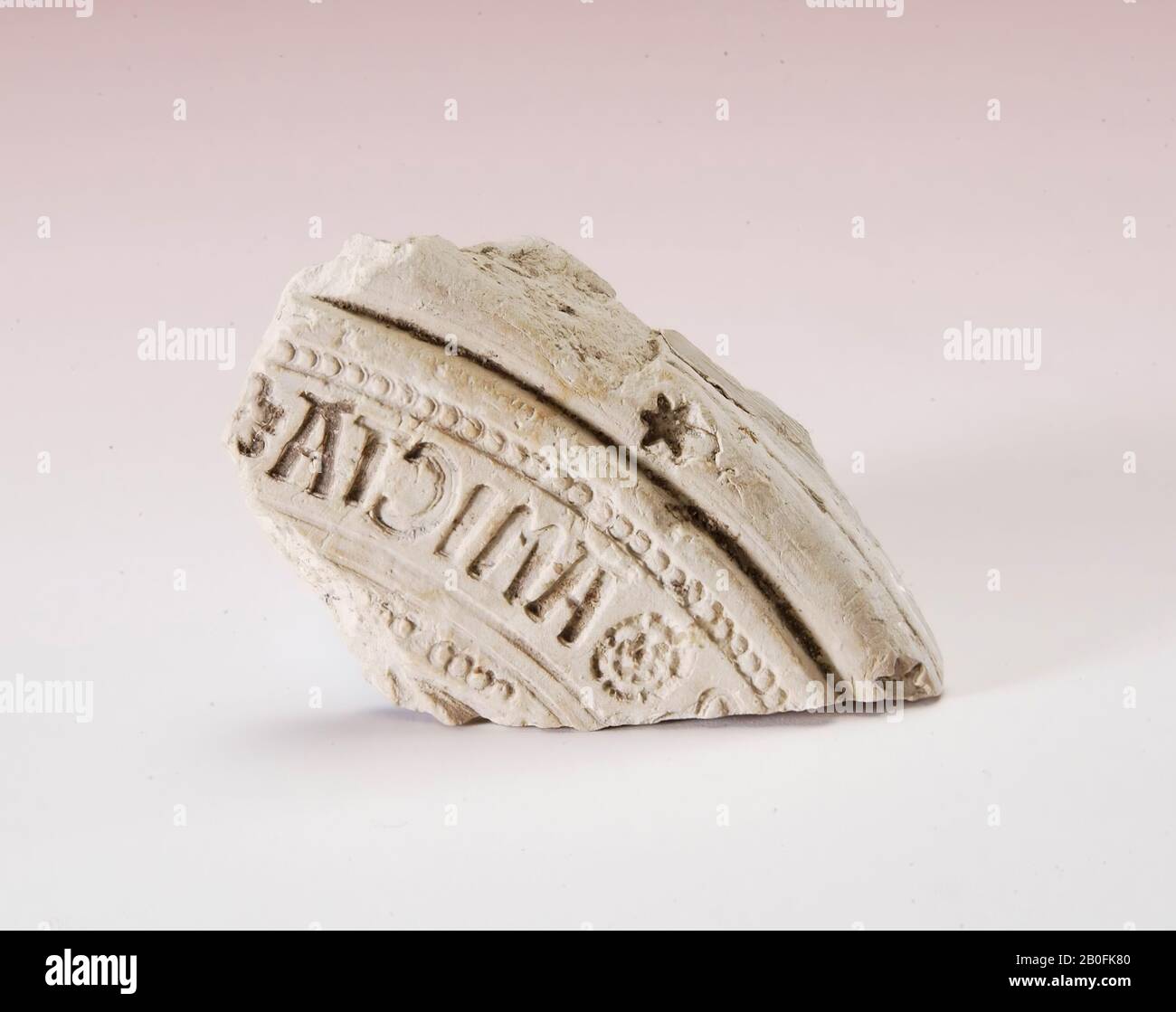 Single mold (front). Fragment of decorated pedestal with text: [Et ...