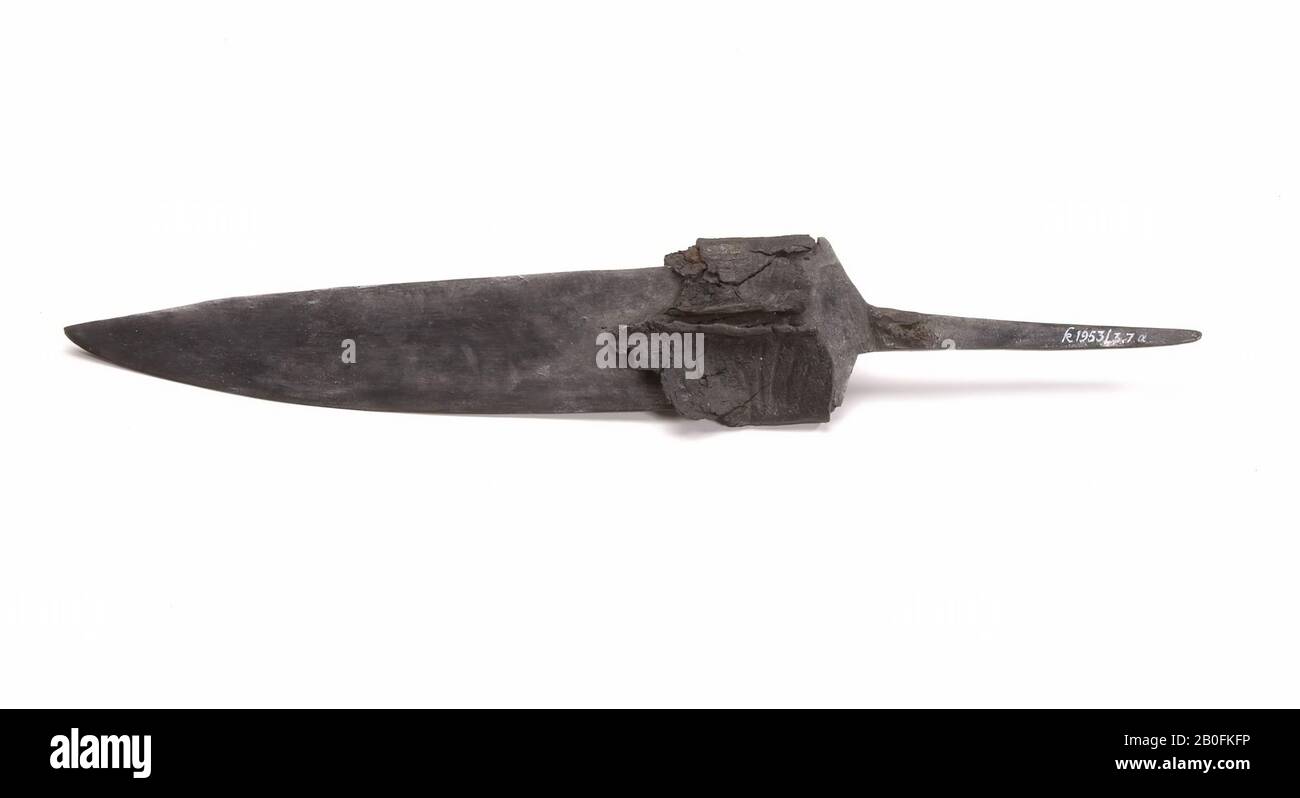 A broad, single-edged knife with remnants of the leather sheath with ...