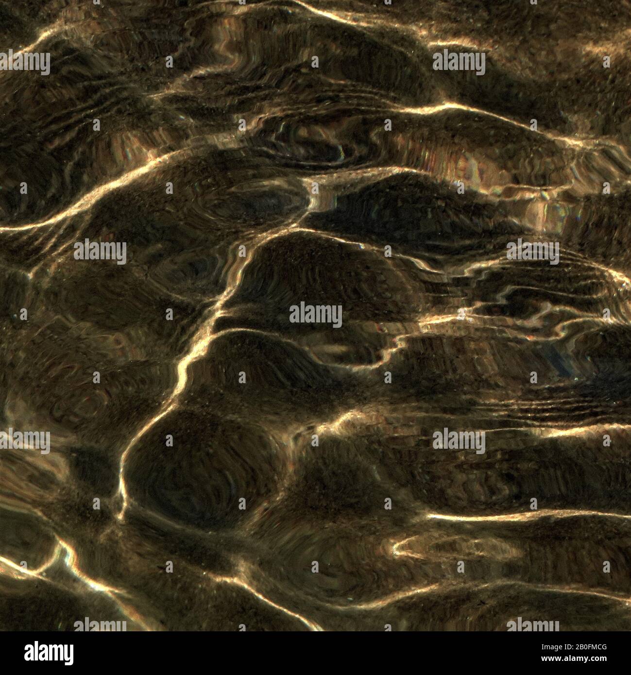 Sea shore with gentle waves and patterns of sea surf and tidal flow in ...