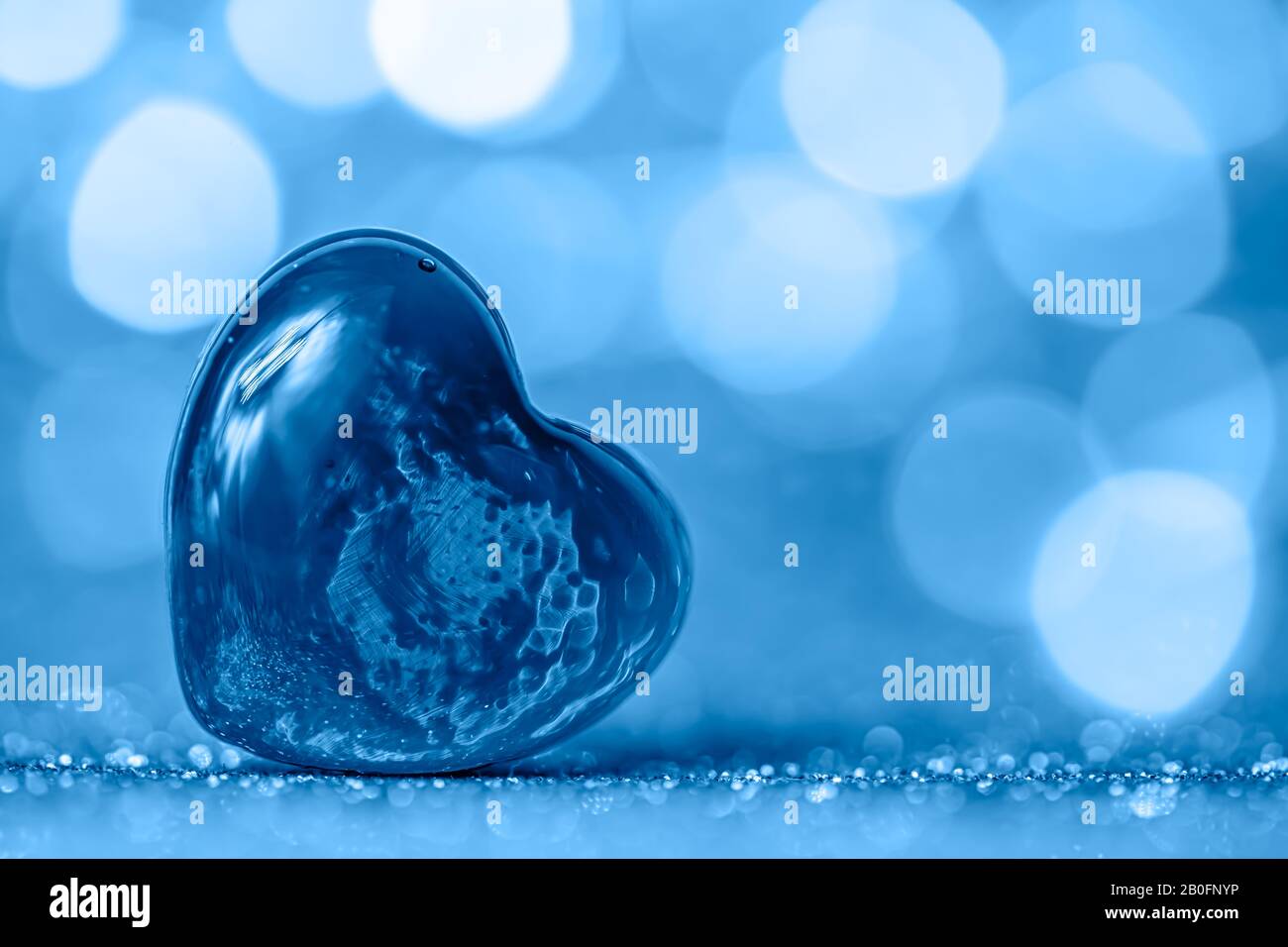 transparent heart against the background of the lights. trend colour ...