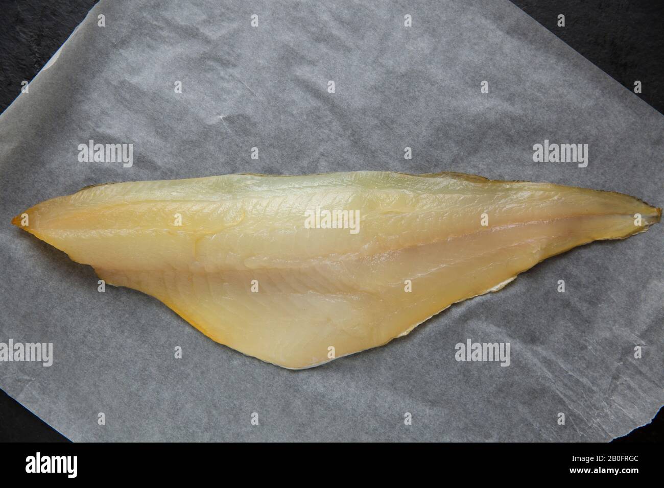 A smoked, undyed haddock fillet, Melanogrammus aeglefinus, bought from ...