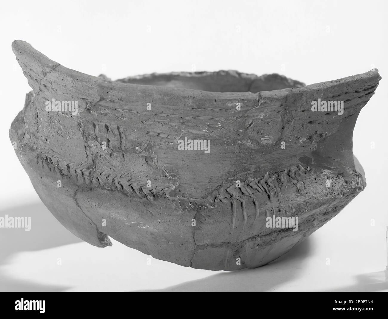 7 fragments of a pot of earthenware with a somewhat upright belly, with ...