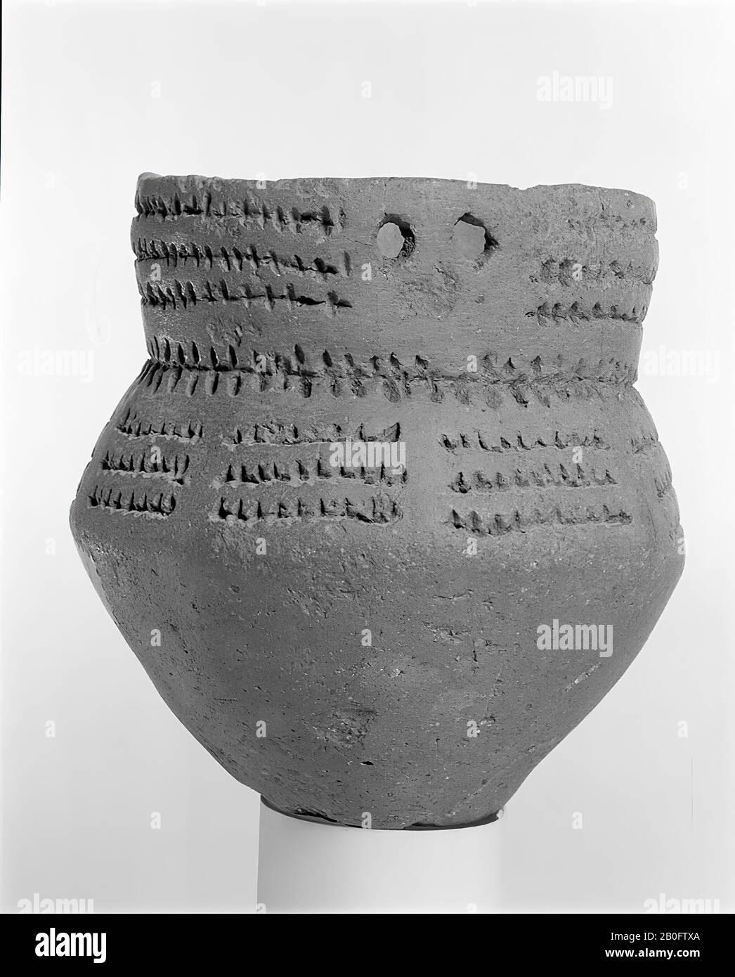 Savory pottery pot with raised edge. Printed decoration on the upper ...