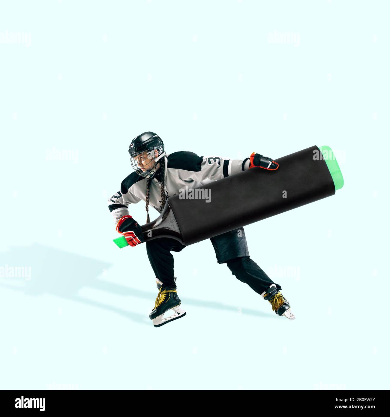 Hockey player using huge marker like stick on blue background ...