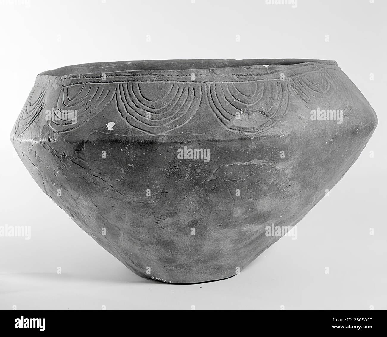 Plaster cast of a large urn with a wide wall. The upper part is ...