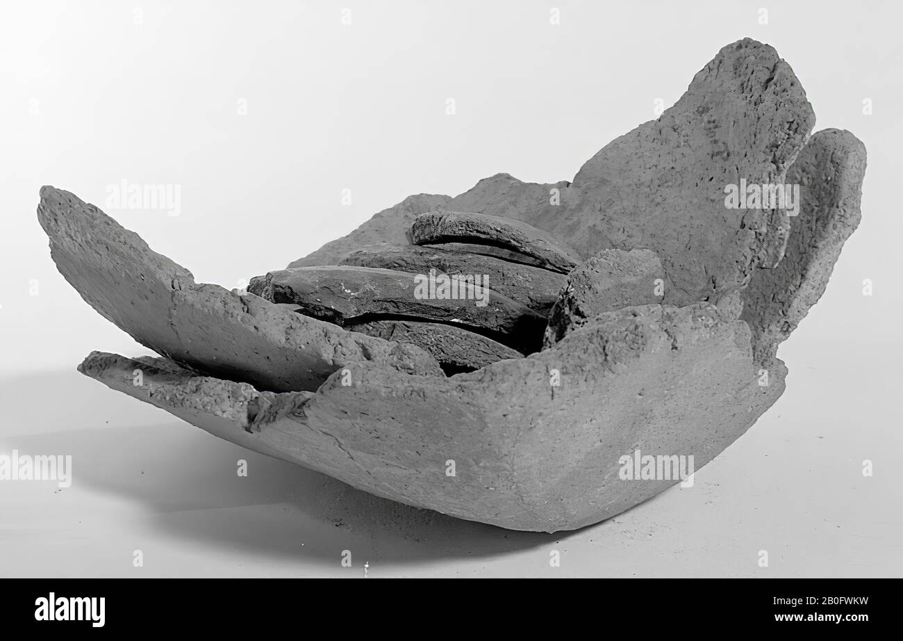 Two large and a small fragment of earthenware urns. The two large ...