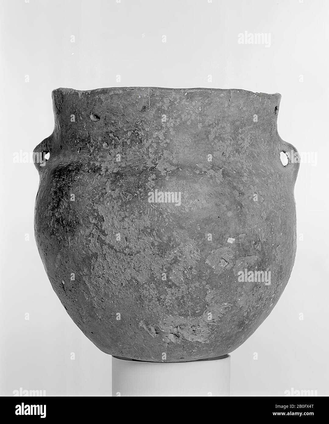 small pot of fairly thin earthenware, spherical with raised edge, and ...