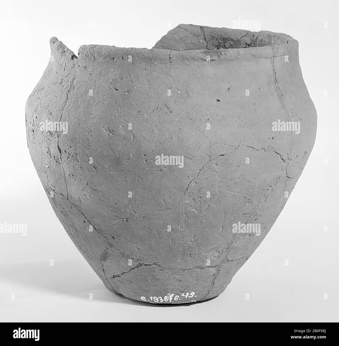 Small urn with a bend of coarse pottery, slim: broken into 17 fragments ...